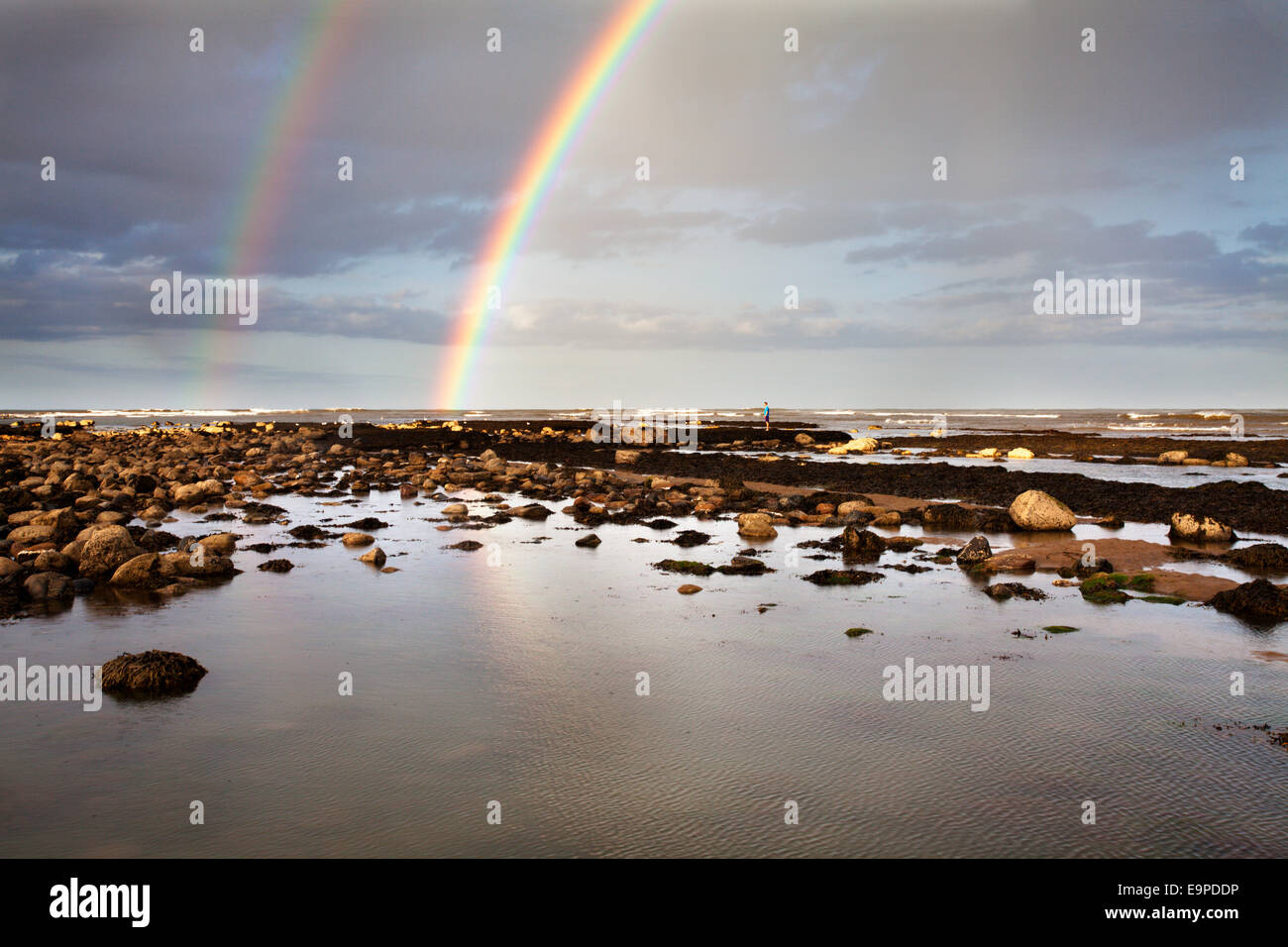 Lone Figure on a Beach under a Double Rainbow Robin Hoods Bay Yorkshire ...