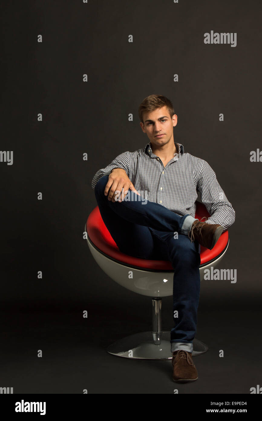 Sits in chair hi-res stock photography and images - Alamy