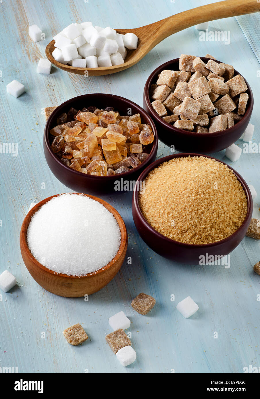 Sugar on wooden table. Selective focus Stock Photo - Alamy