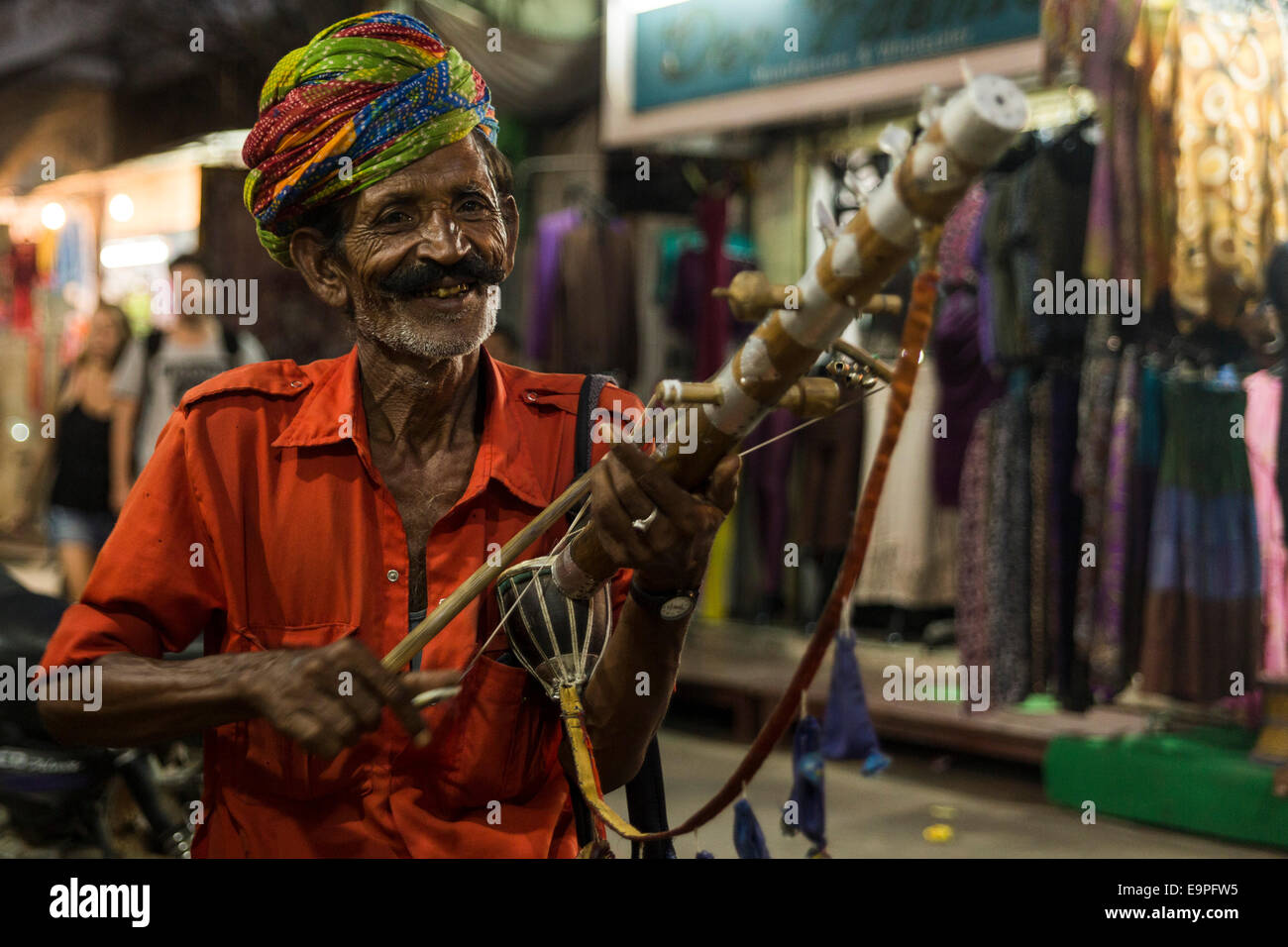 Man playing traditional instrument pushkar hi-res stock photography and ...