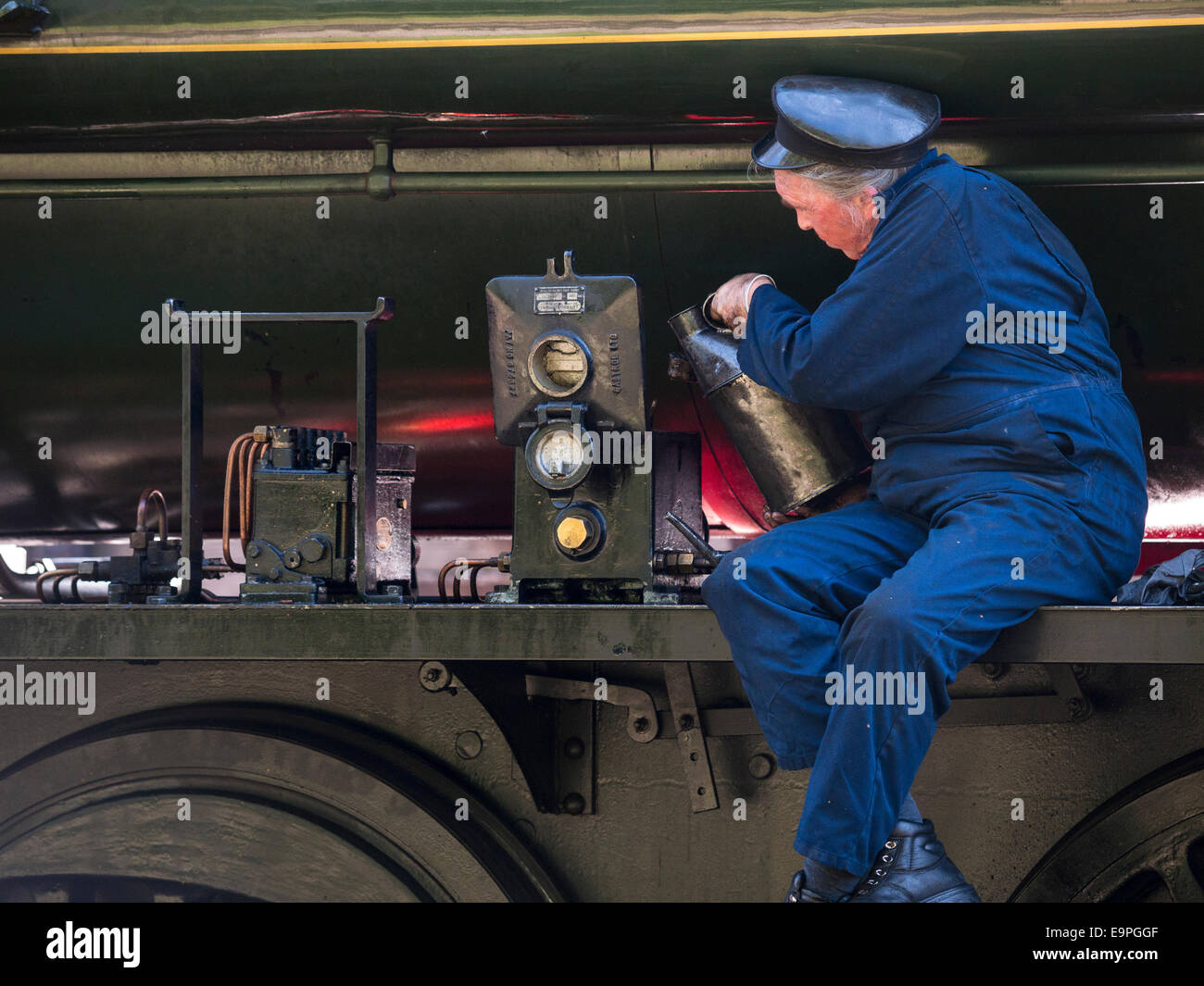 driver and fireman prepare a locomotive at Peak Rail Steam Railway at ...
