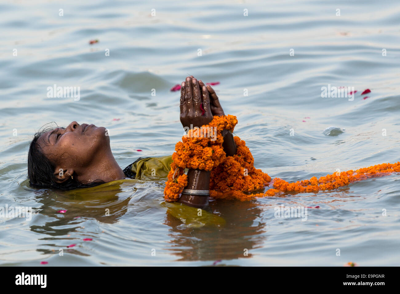 Indian woman bathing in river hi-res stock photography and images - Alamy