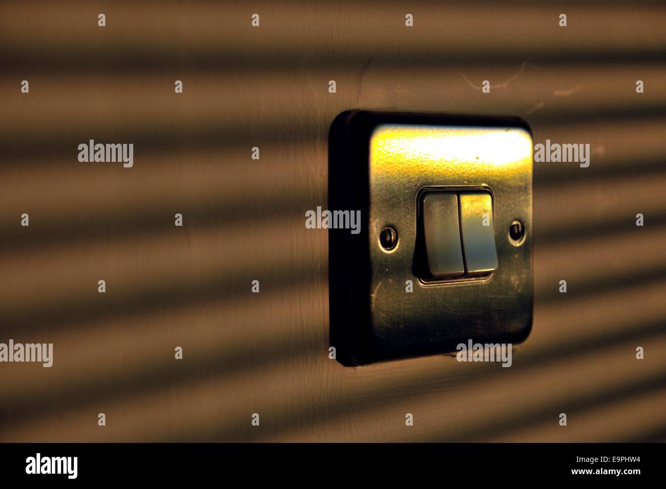 Shadows fall across a light switch Stock Photo - Alamy