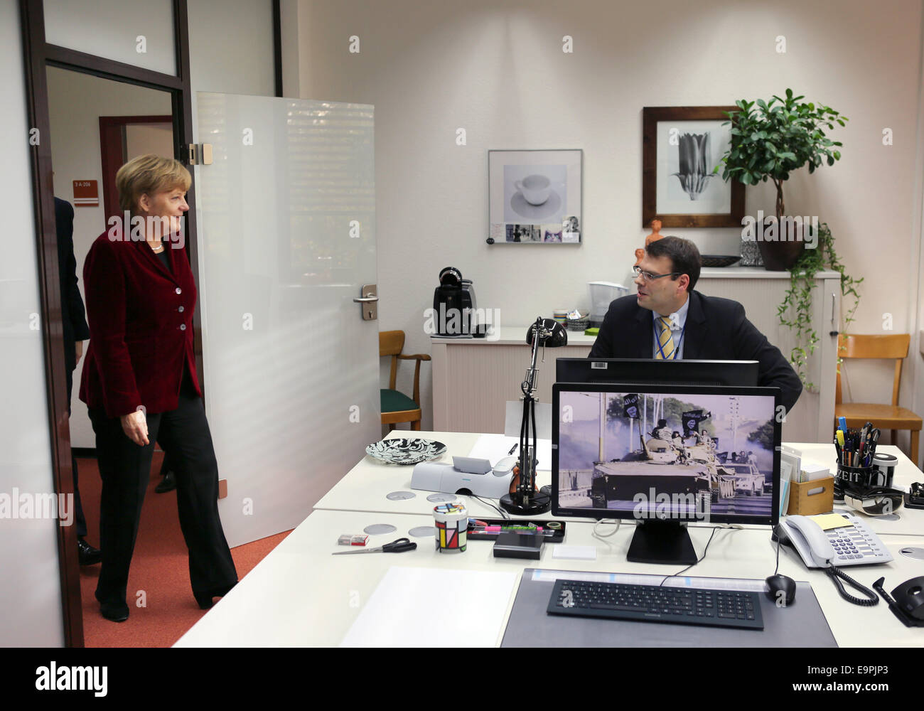 Cologne, Germany. 31st Oct, 2014. German Chancellor Angela Merkel (L ...