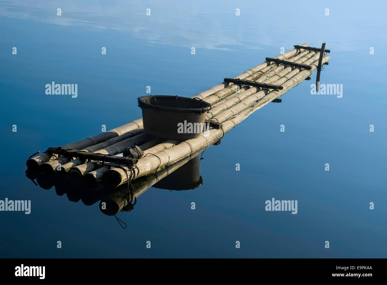 Sunrise over a bamboo fishing raft on a lake, Philippines Stock Photo ...