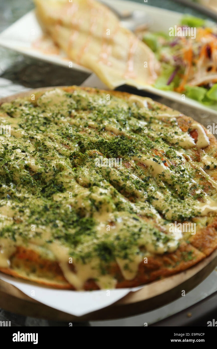 Pizza Japanese style in a cafe Stock Photo - Alamy