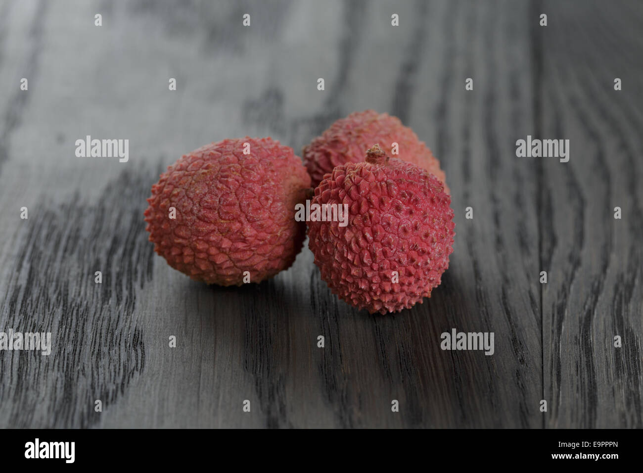 ripe lychee fruits, on old oak table Stock Photo - Alamy