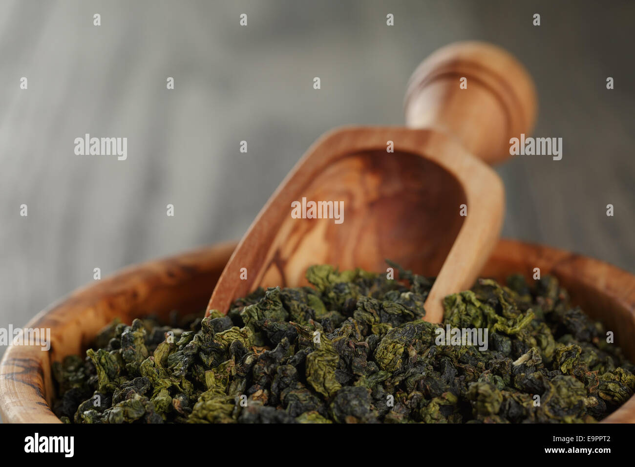 oolong green tea in olive bowl, on oak table Stock Photo - Alamy
