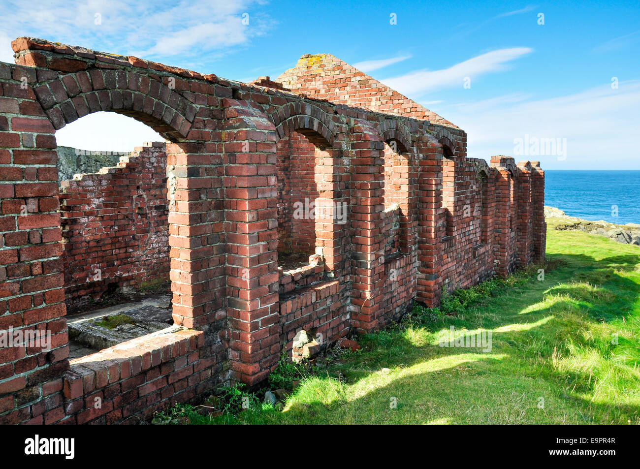 Red brick buildings. Ruins from the industrial activity at Porthgain in ...
