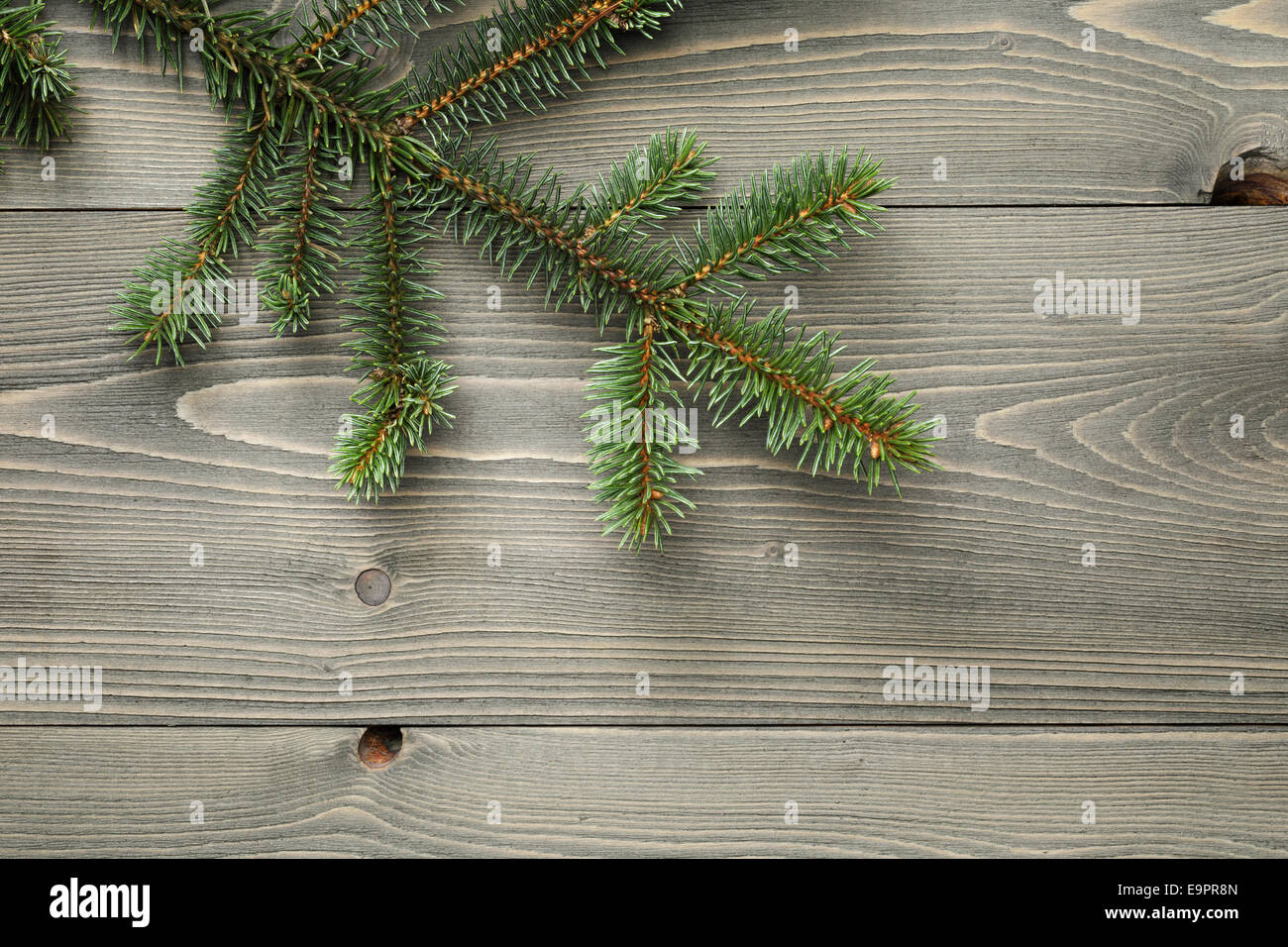 spruce twig on wood table, christmas background Stock Photo - Alamy