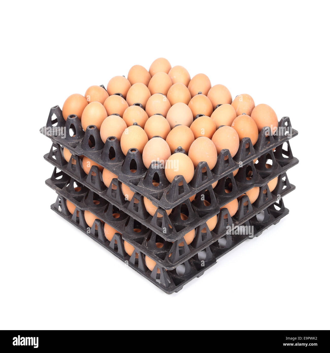 stack of eggs in tray on white background Stock Photo - Alamy