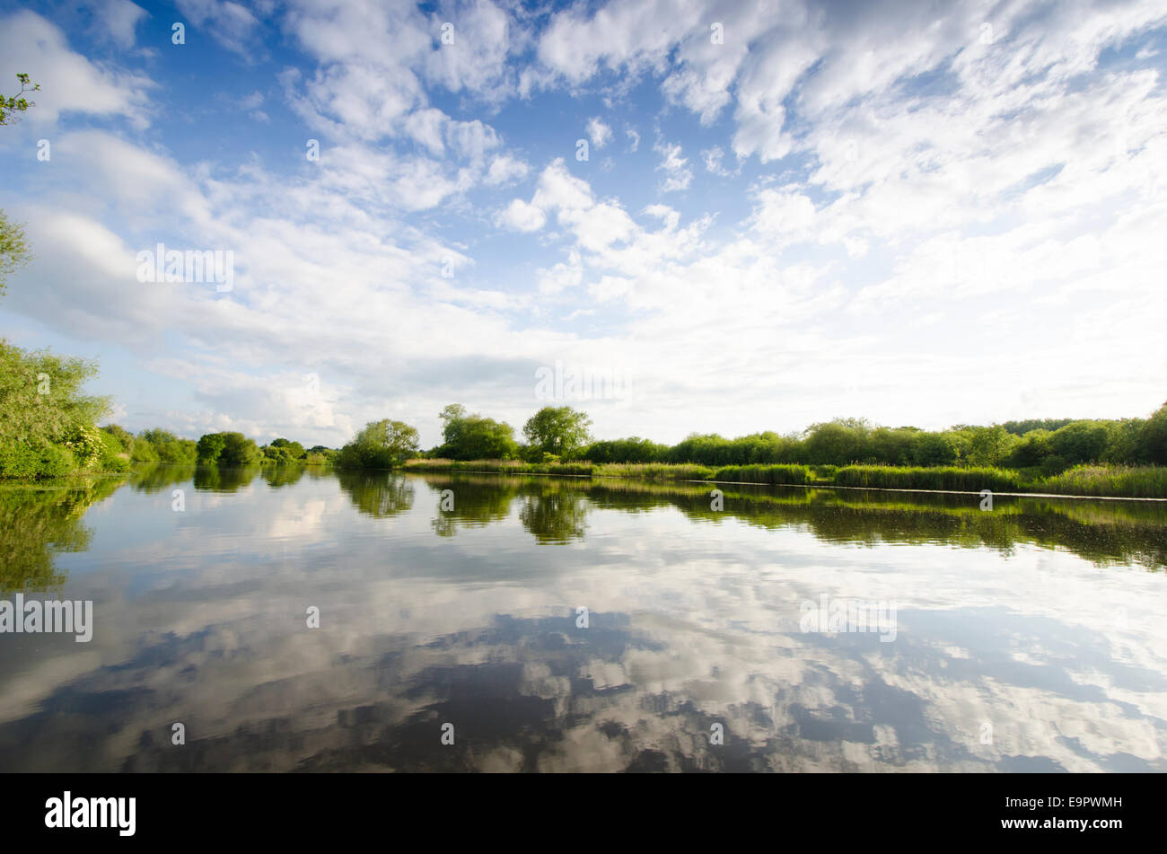 Cloud formations and reflections on the River Yare near Surlingham ...