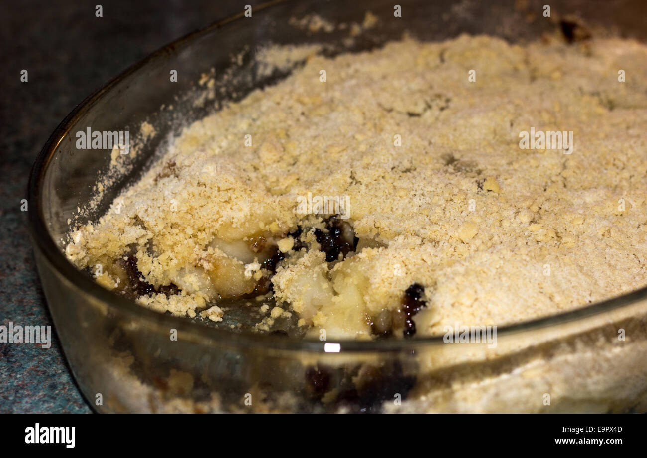 Apple and sultana crumble just cooked and ready to prepare from a clear ...