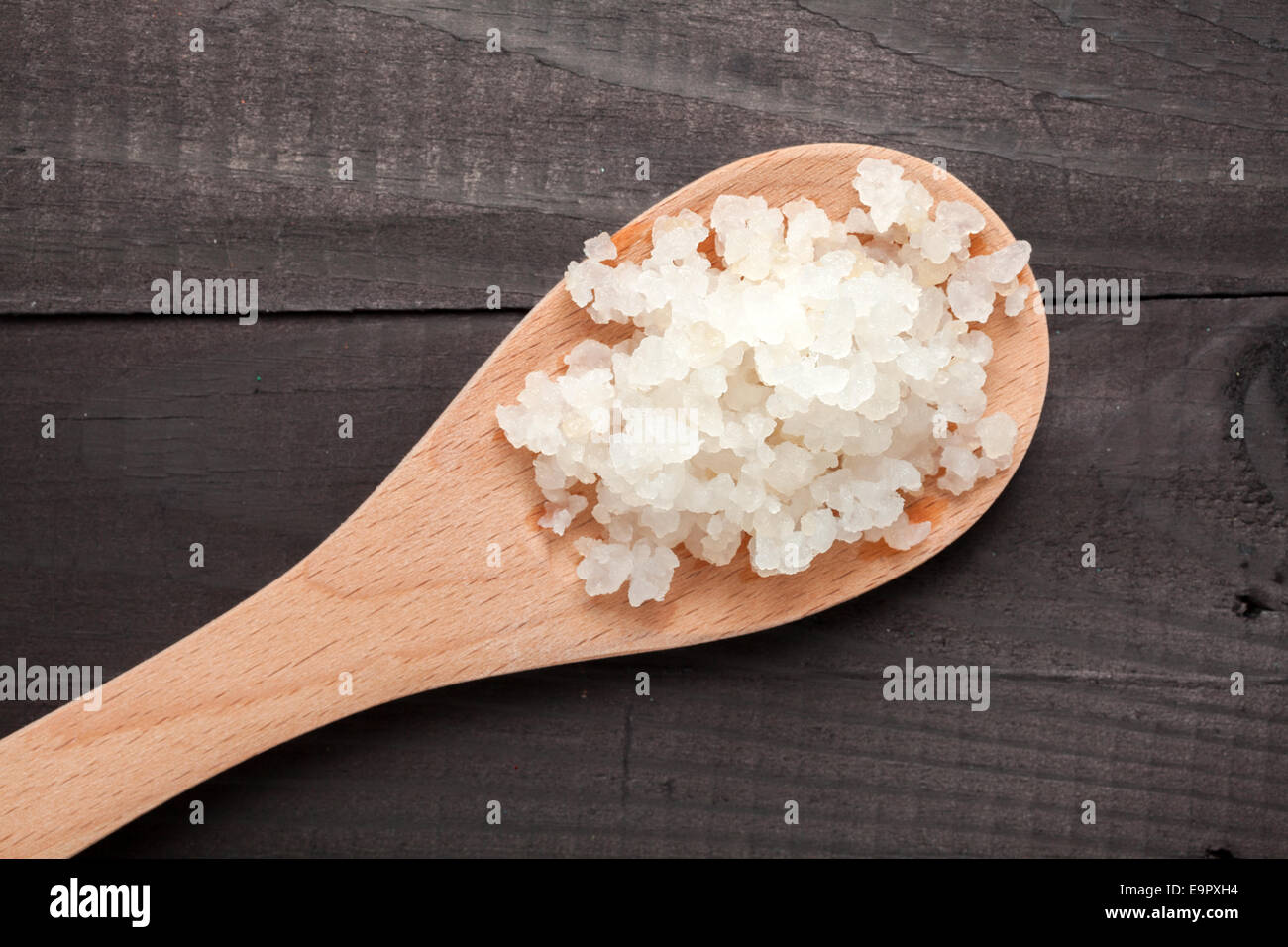 Water kefir grains into a wooden spoon on black wooden background Stock ...