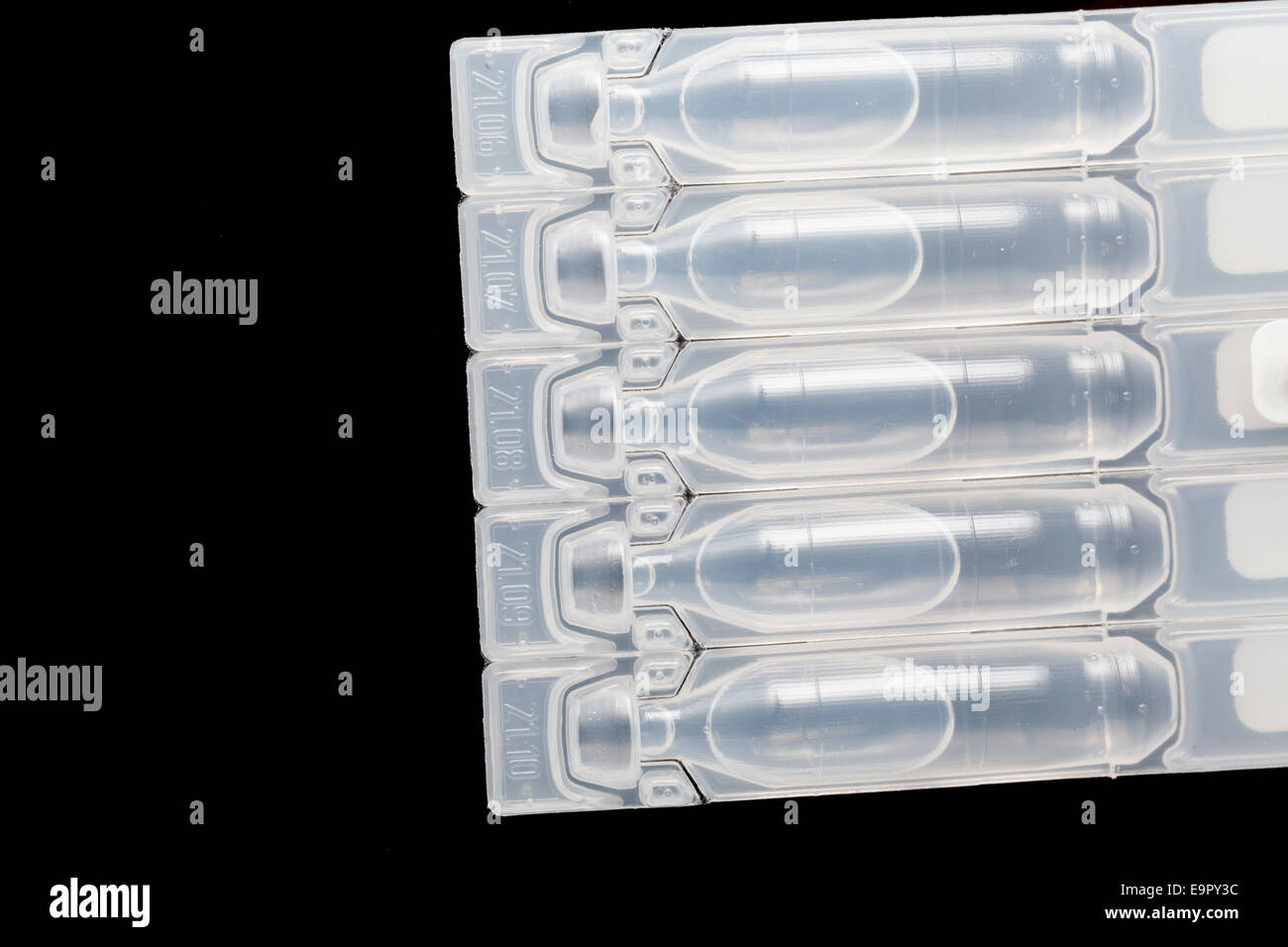 Plastic Ampules on black background Stock Photo - Alamy