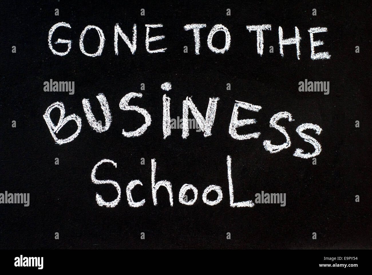 Gone to the business school message written with white chalk on ...