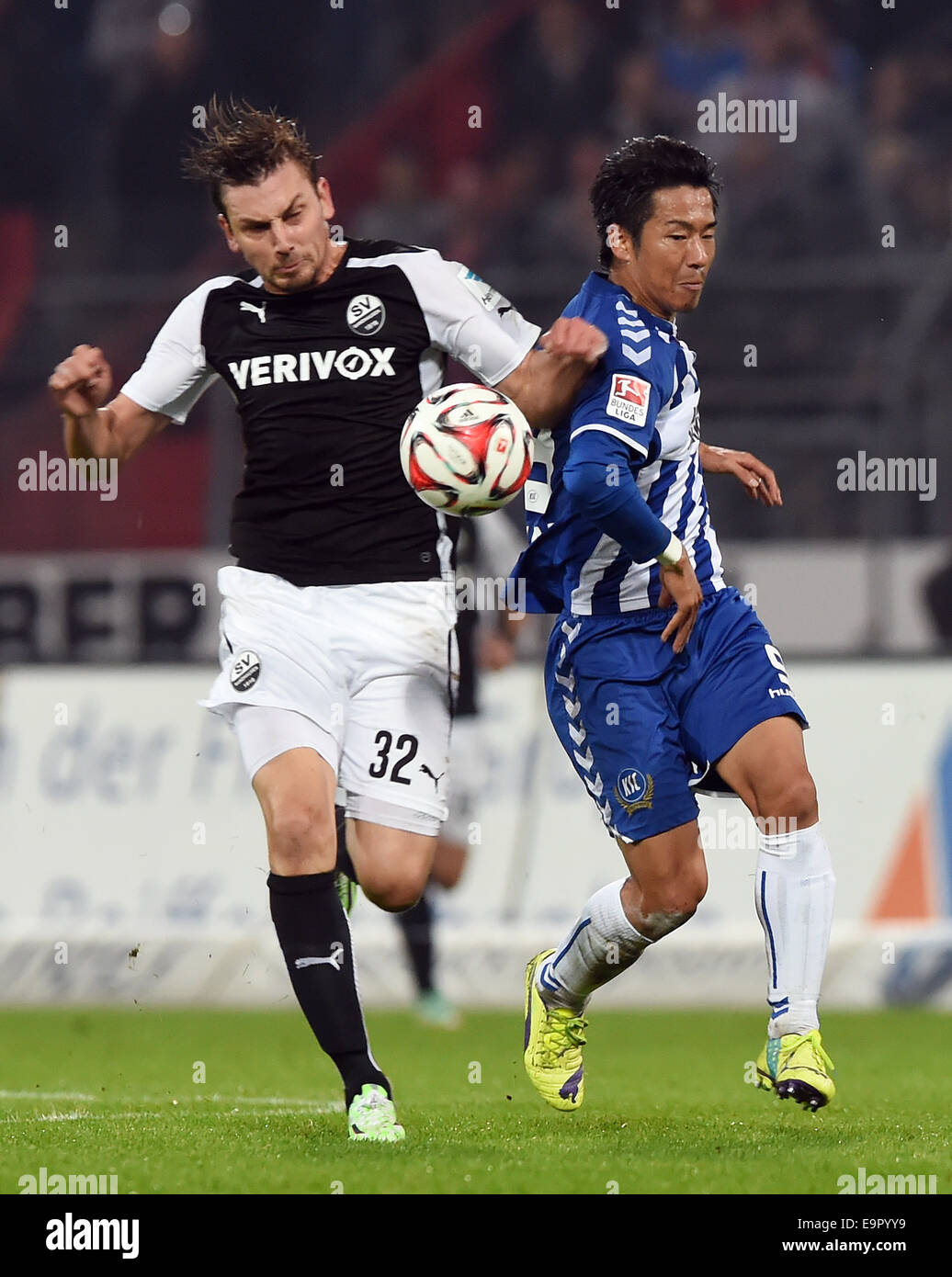 Karlsruhe, Germany. 31st Oct, 2014. Karlsruhe's Hiroki Yamada (R) and ...