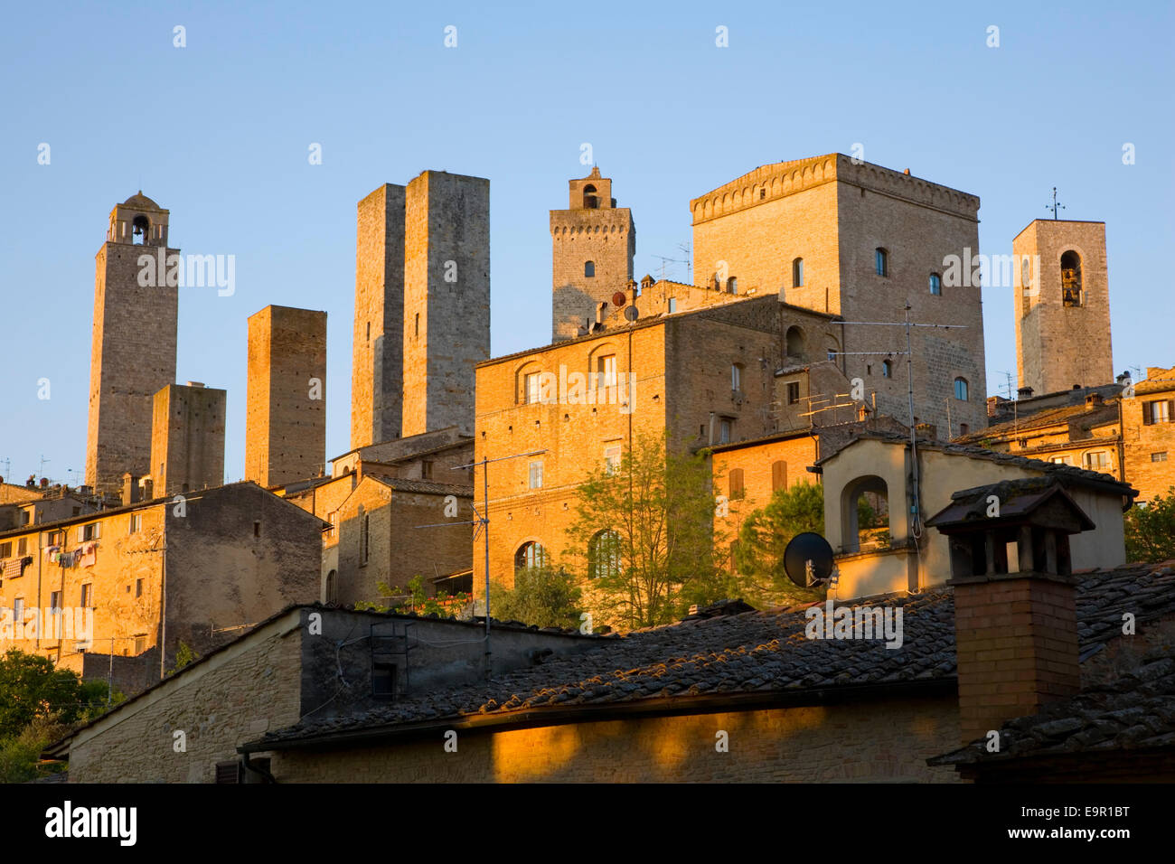 San Gimignano, Tuscany, Italy. Cluster of medieval towers lit by the ...