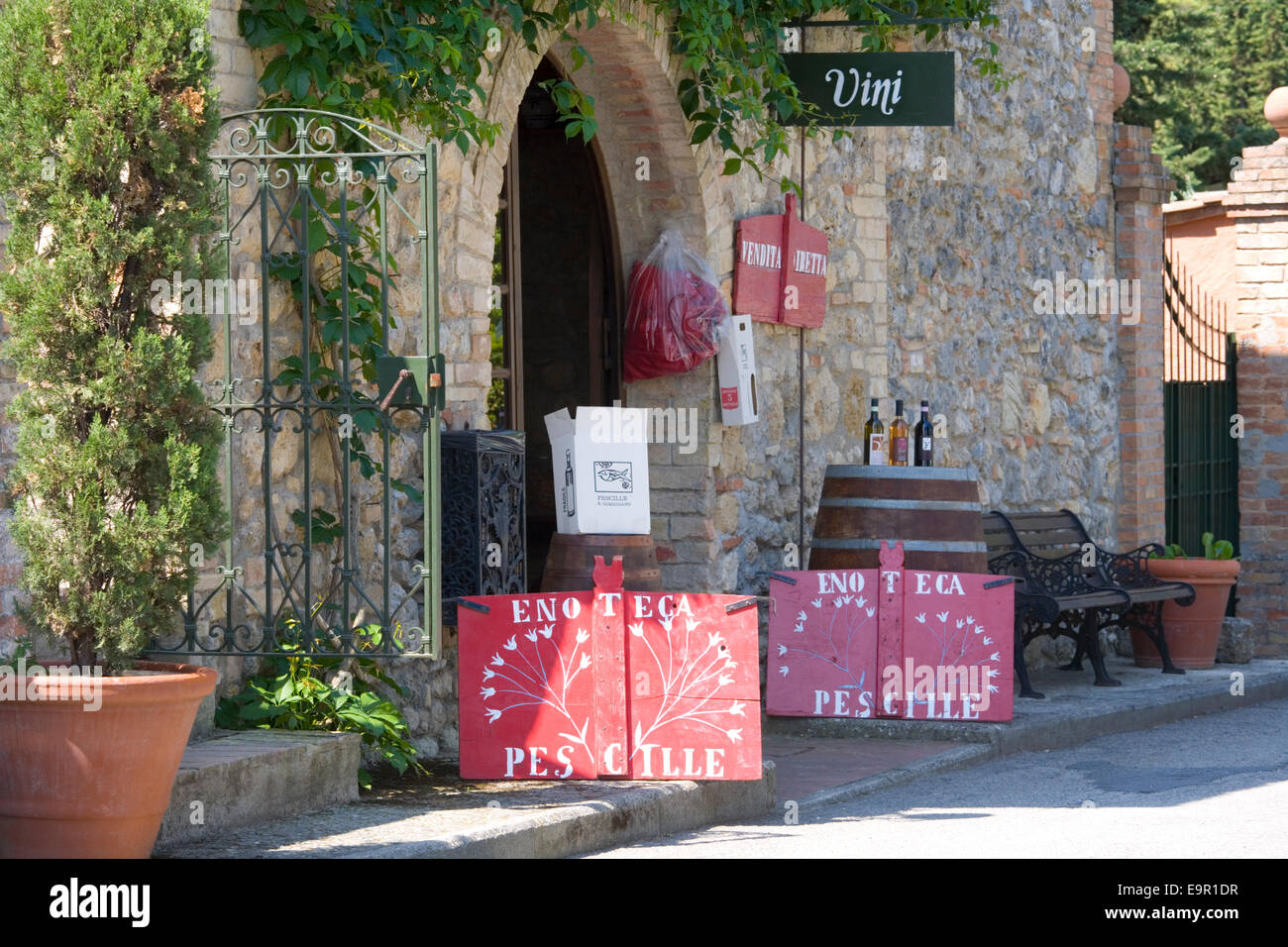 San Gimignano, Tuscany, Italy. Colourful signs on display outside a ...