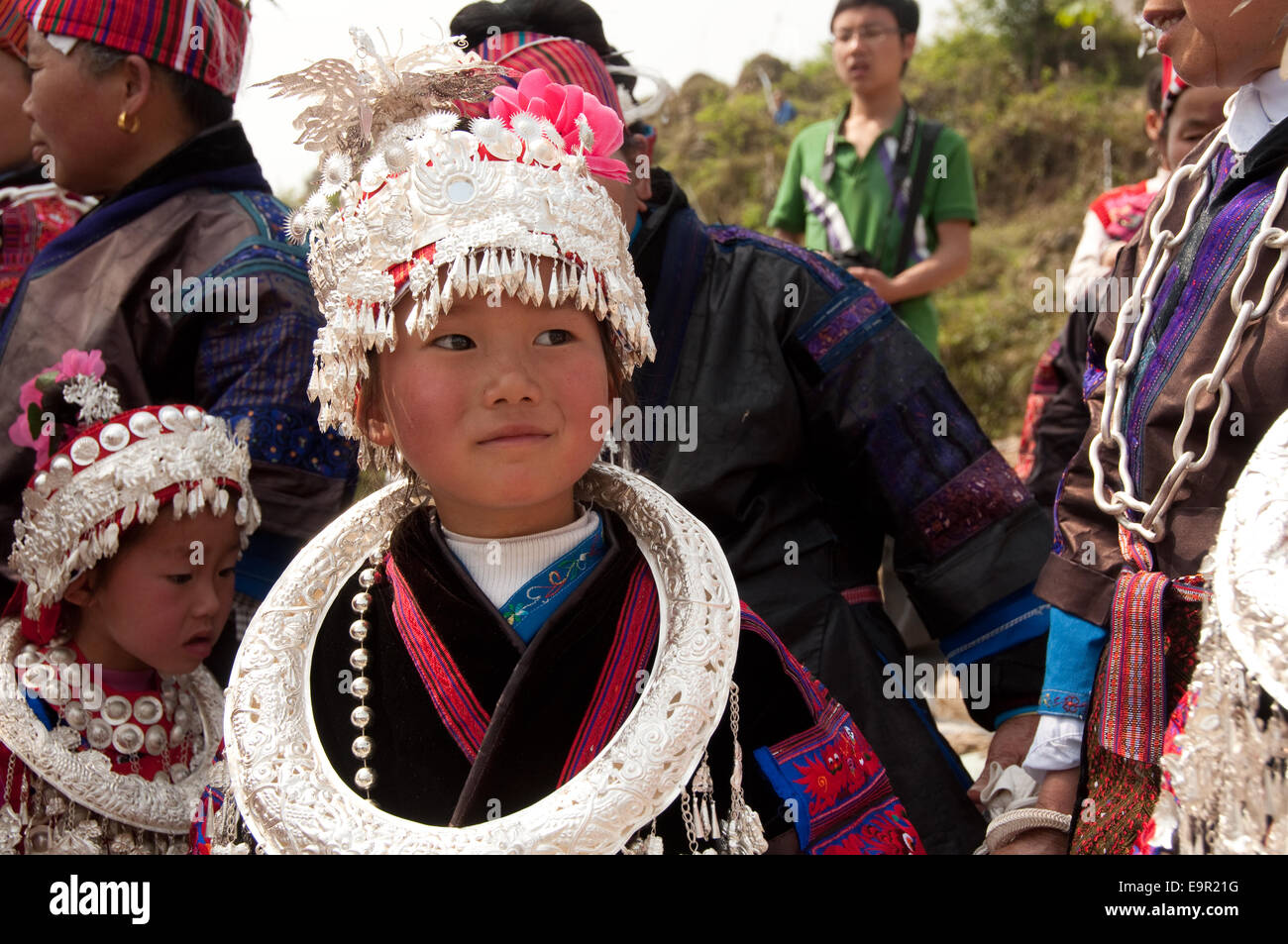 Young Miao girls with silver headdressed and massive necklaces during ...