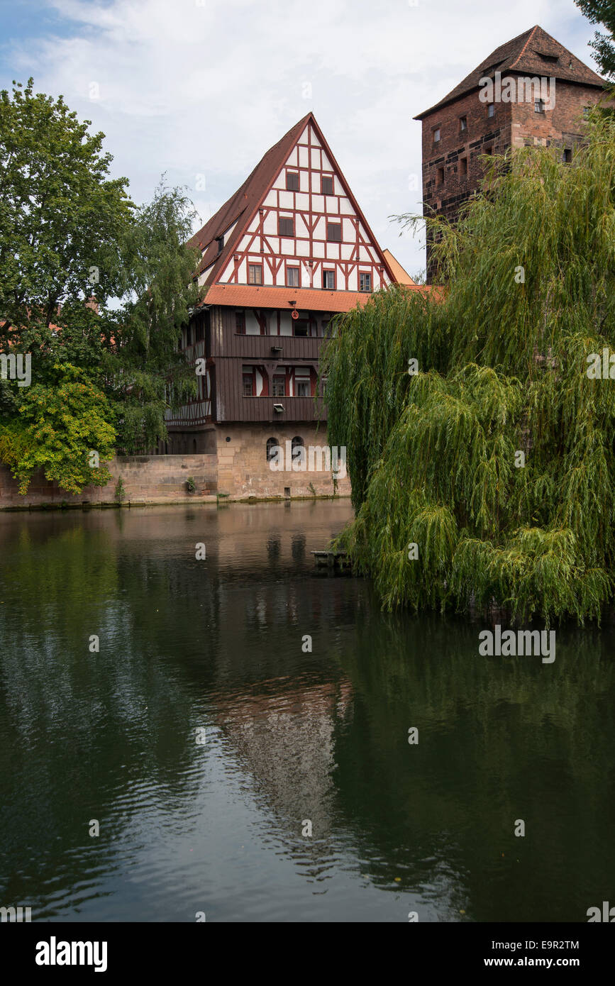 Vertical landscape with river, hotel, and tower of medieval castle ...