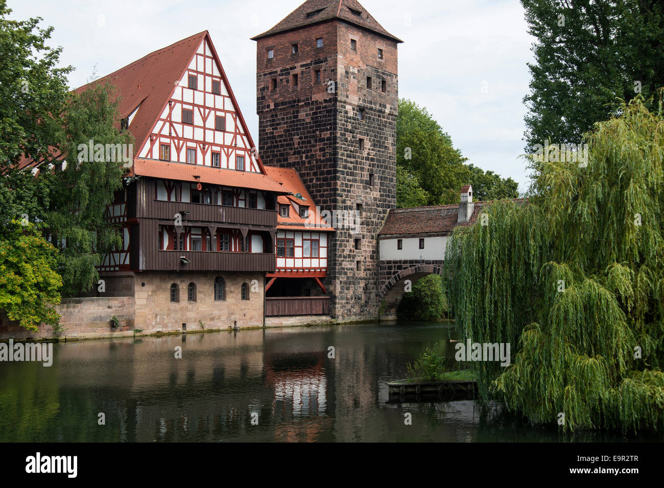 Beautiful view of Nuremberg with river, hotel, and tower of medieval ...