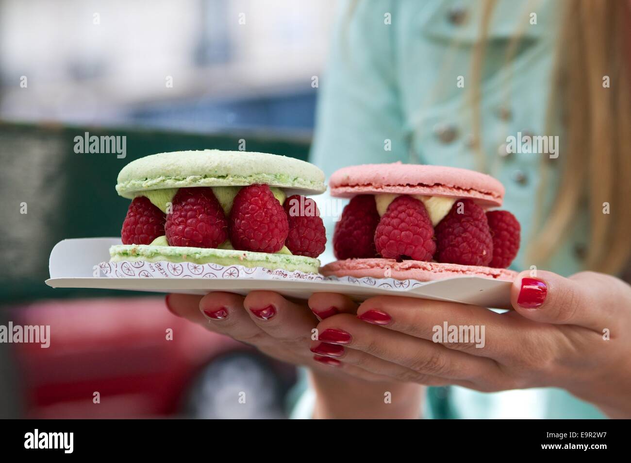 Tasty cookies macroni in woman's hands Stock Photo - Alamy