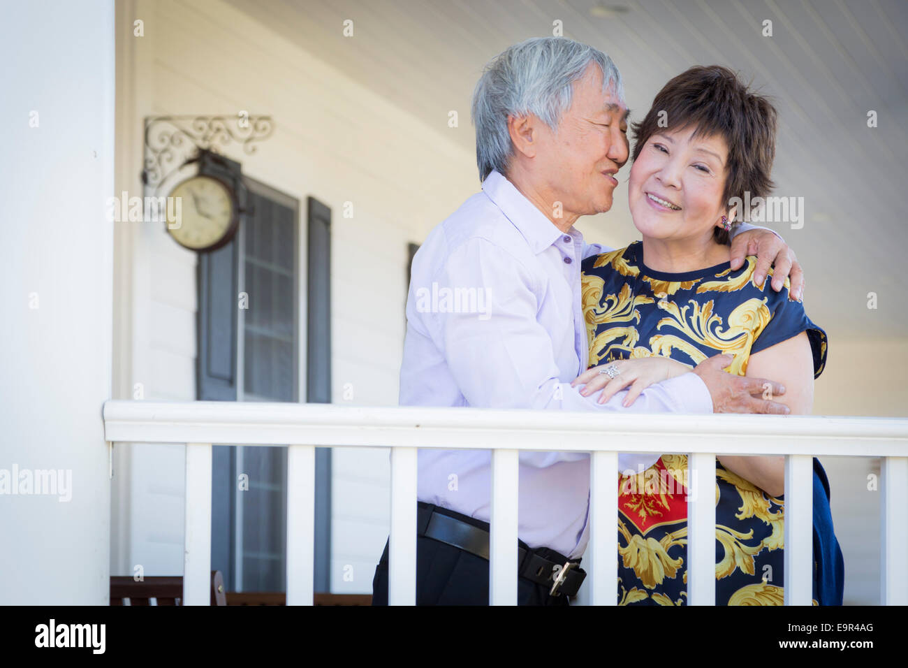 Attractive Happy Chinese Couple Enjoying Their House Outside Stock ...