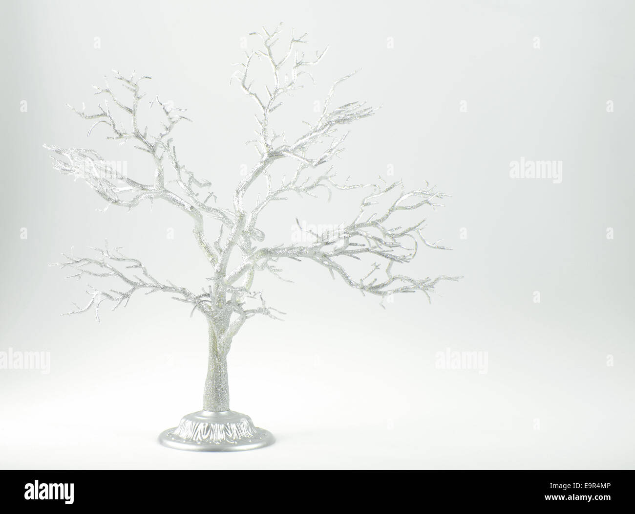 Silver ornamental tree. Studio shot Stock Photo - Alamy
