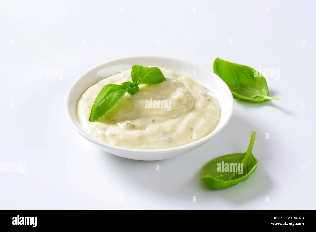 Creamy salad dressing made of mayonnaise, buttermilk, garlic, herbs ...