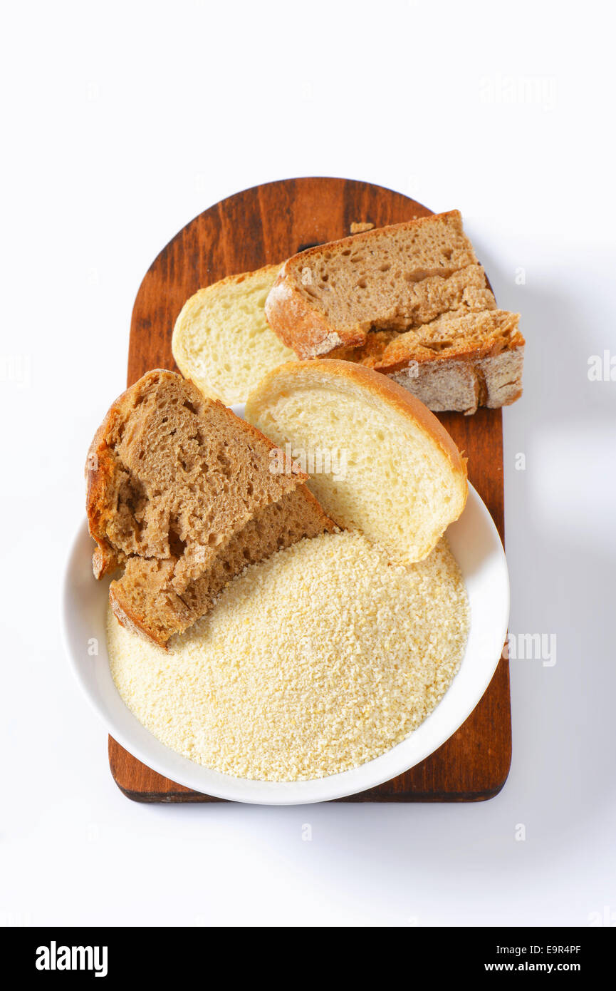 Pieces of stale bread and pile of finely ground bread crumbs Stock ...