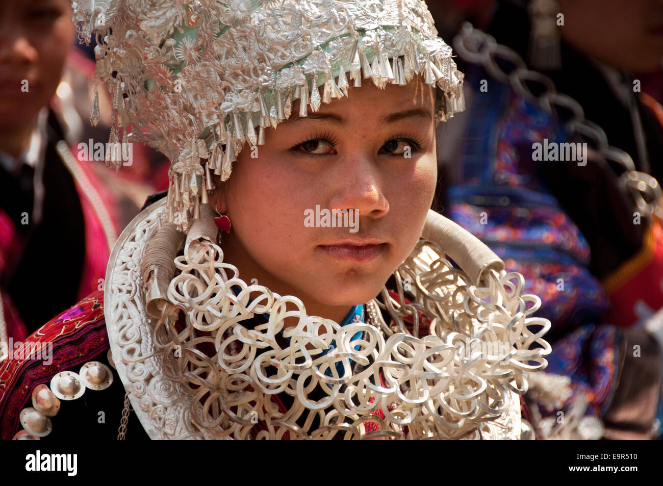 Miao girl with silver headdress and necklaces, Sister Meal Festival ...
