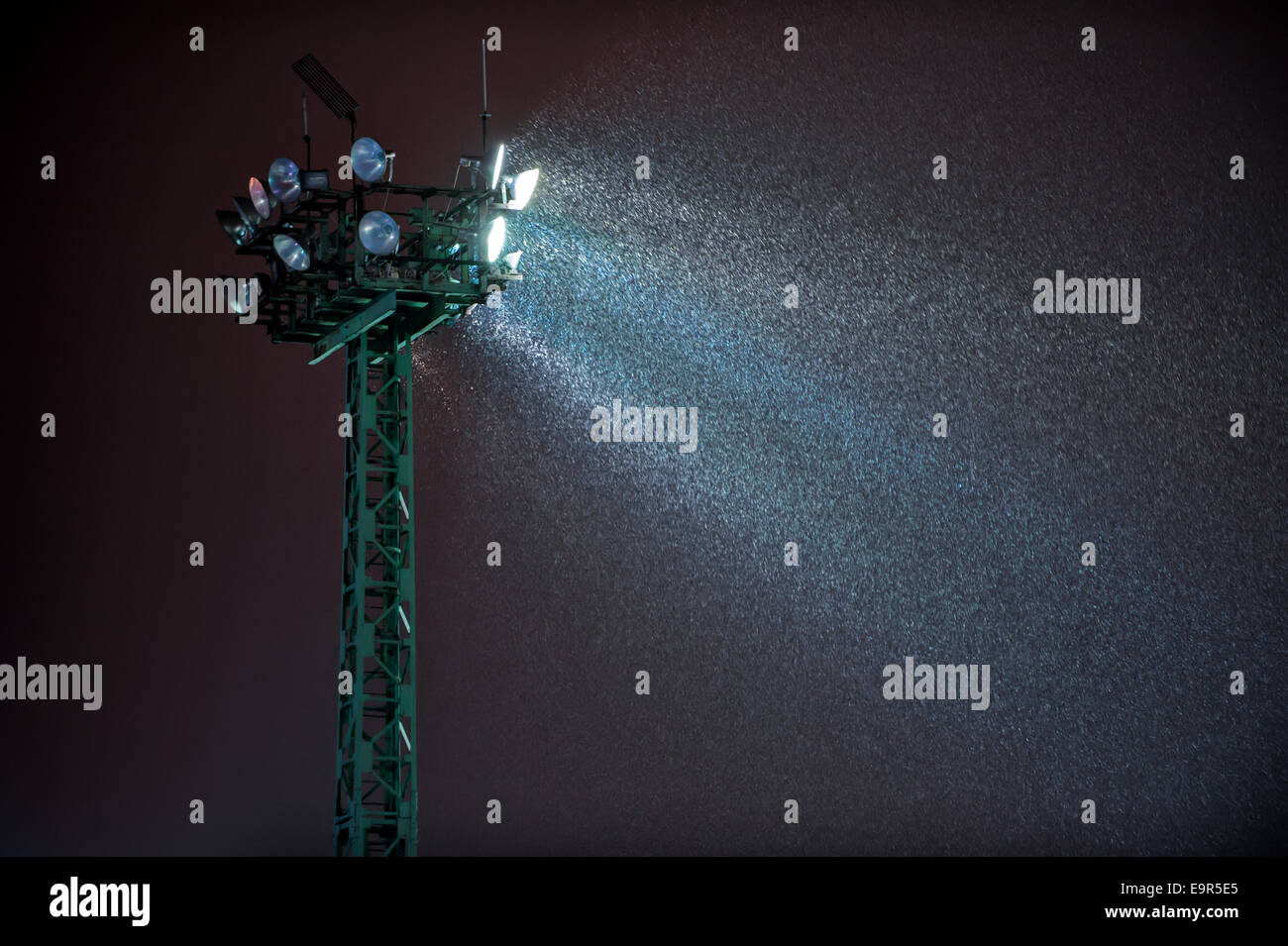 Searchlight and night snowfall Stock Photo - Alamy