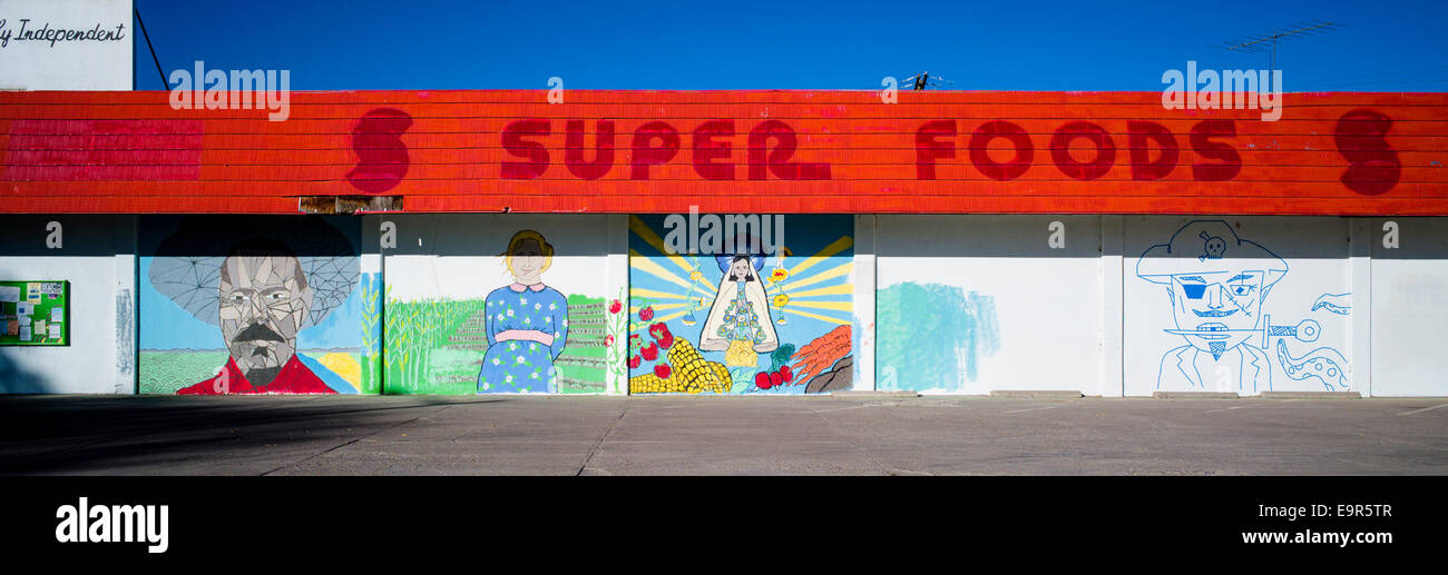 Colorful murals on exterior wall of old grocery store Stock Photo - Alamy