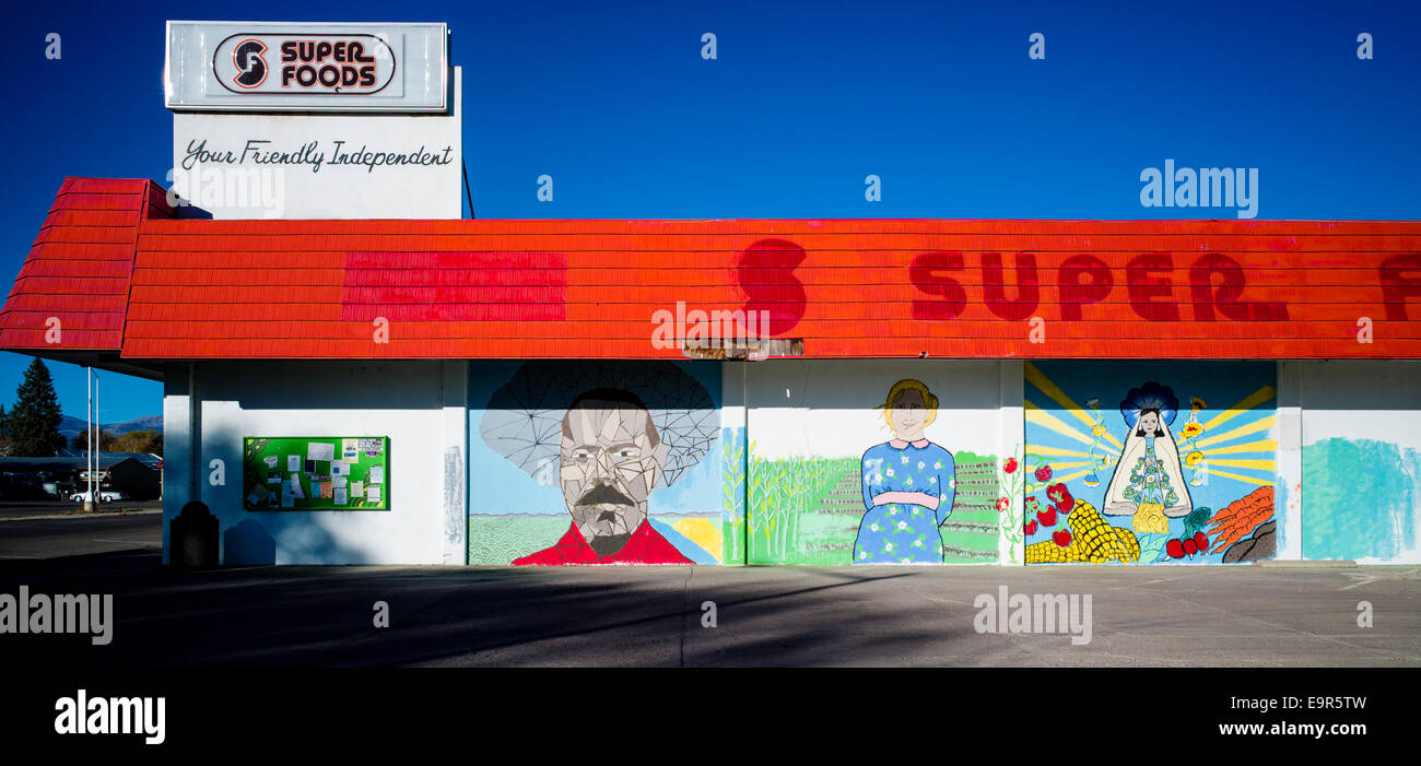 Colorful murals on exterior wall of old grocery store Stock Photo - Alamy