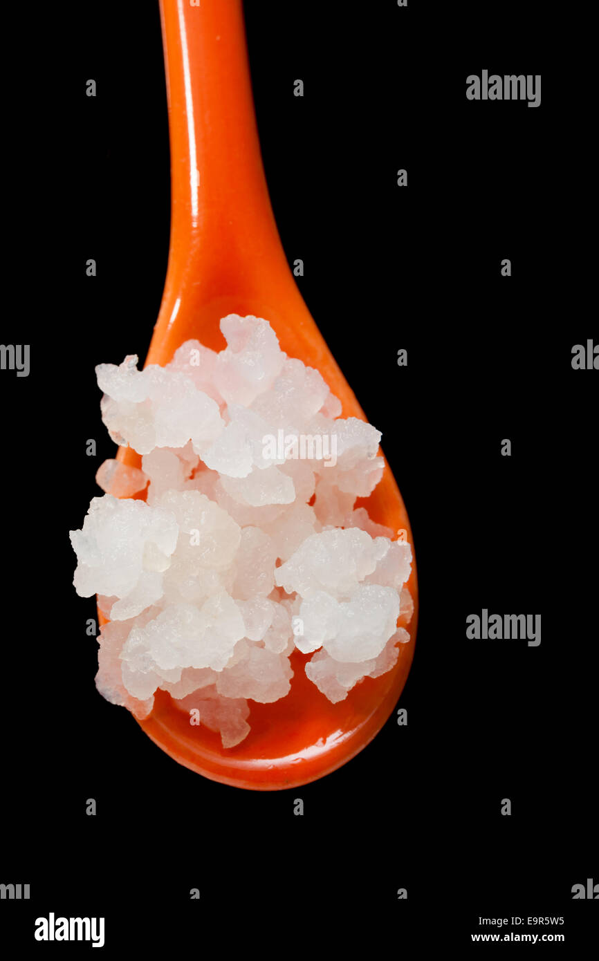 Water kefir grains in orange spoon on black wooden background Stock ...