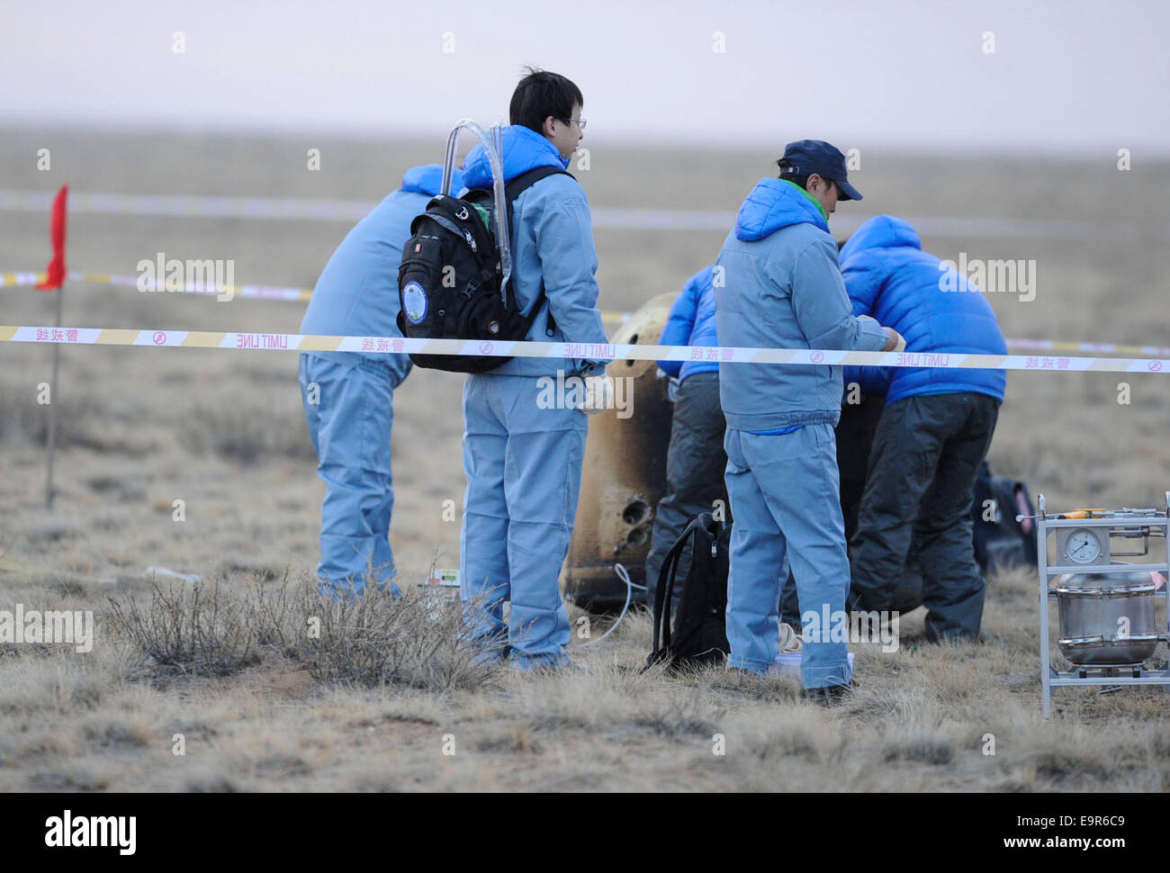 Beijing, China. 11th Nov, 2014. Researchers retrieve the return capsule ...