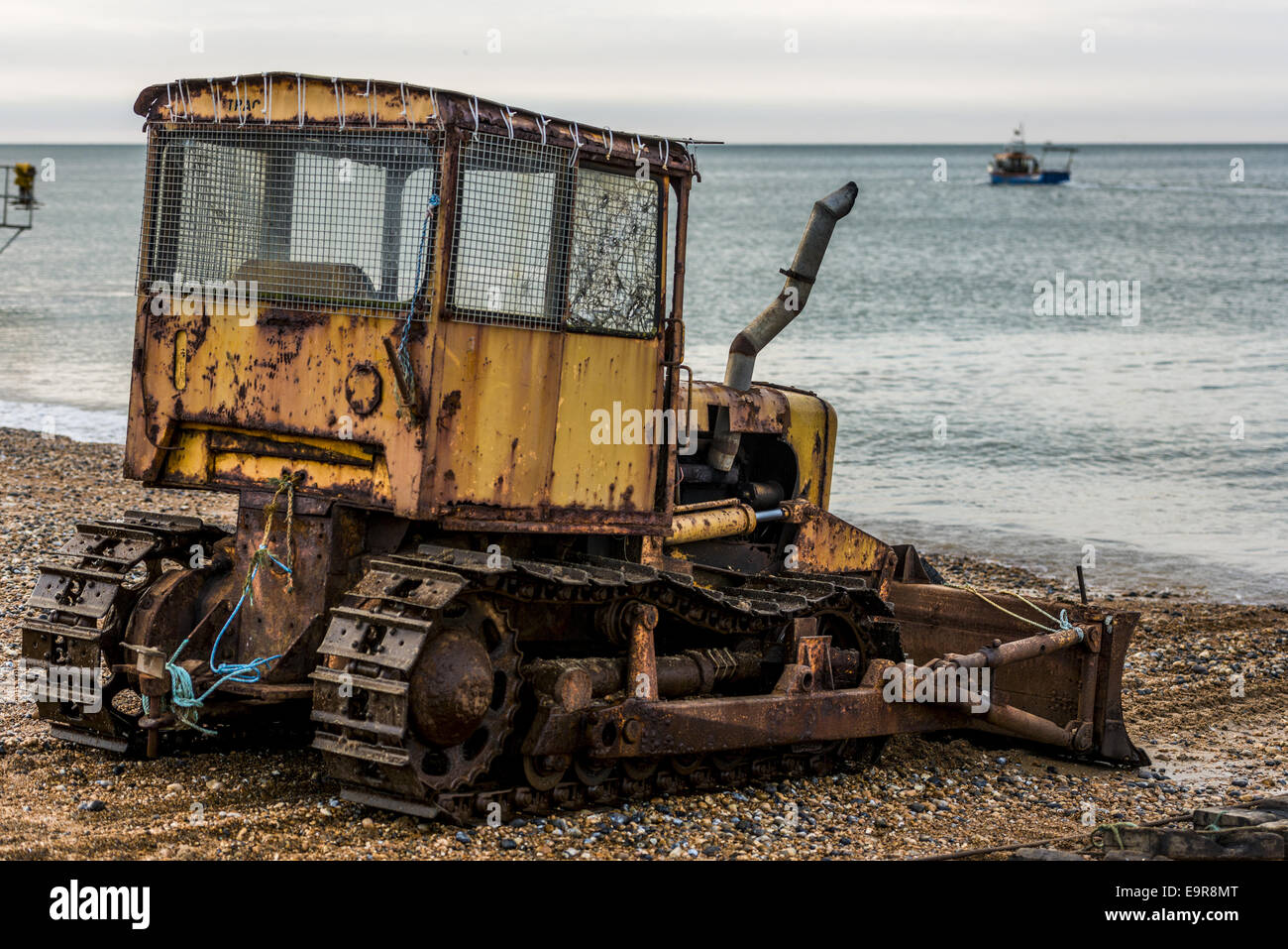 A bulldozer at The Stade, Hastings is used to launch an inshore fleet ...