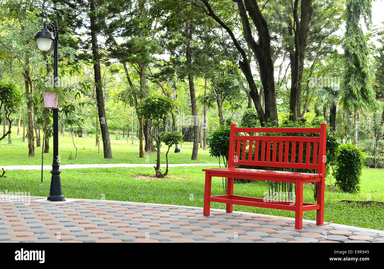 red bench in garden Stock Photo - Alamy
