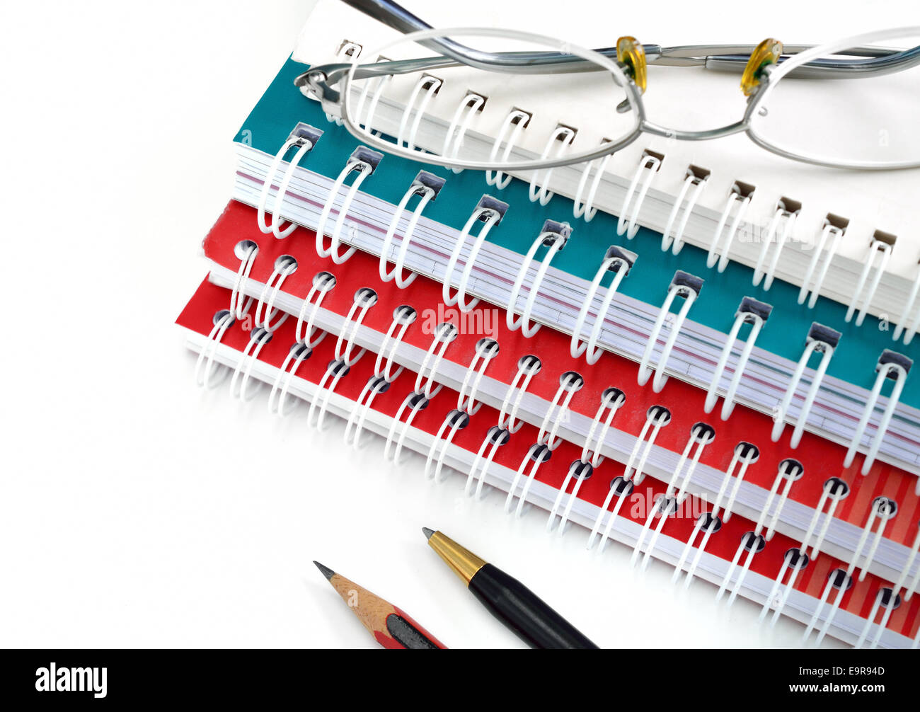 pencil,pen, notebook and glasses isolated on white Stock Photo - Alamy