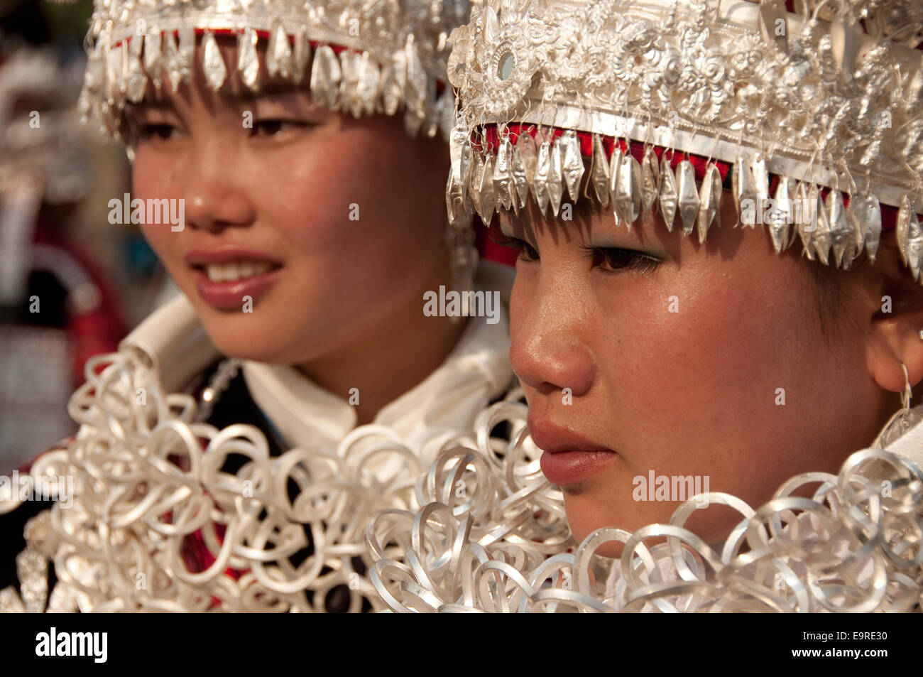 Two Miao girls with traditional wear and silver jewels, Sister Meal ...