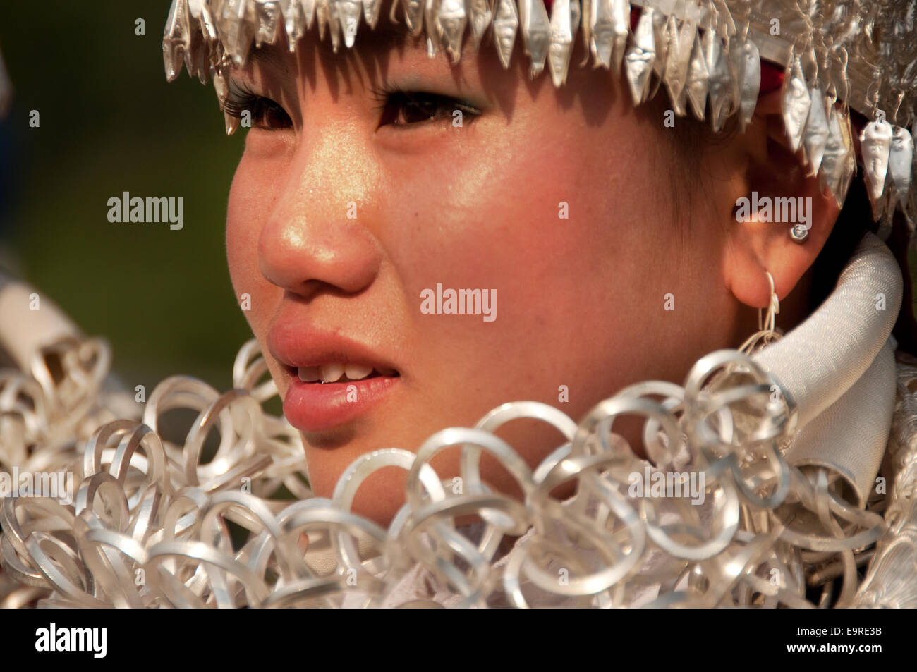 A Miao girl with traditional wear and silver jewels, Sister Meal ...