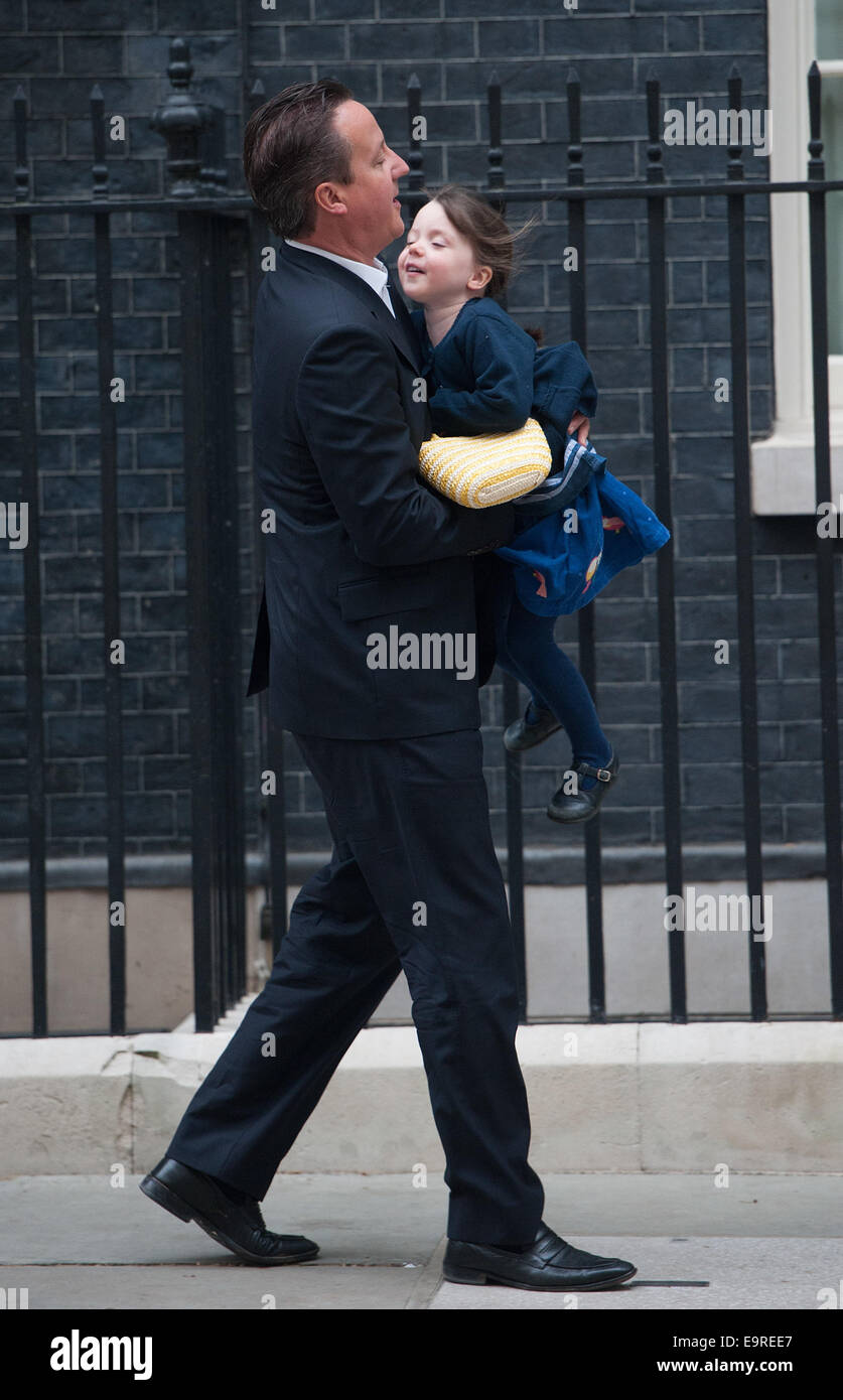 David Cameron leaves Downing Street carrying his daughter Florence ...