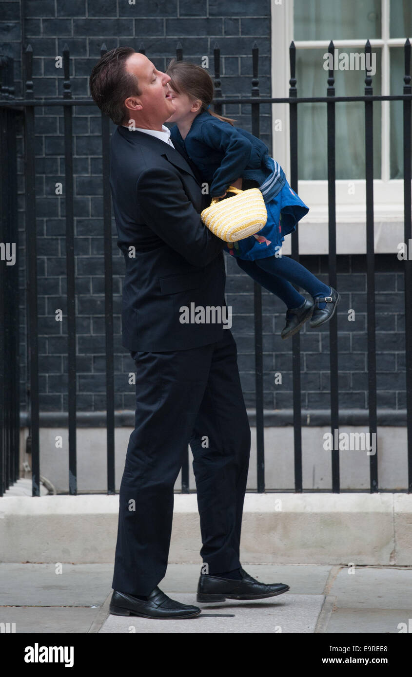 David Cameron leaves Downing Street carrying his daughter Florence ...