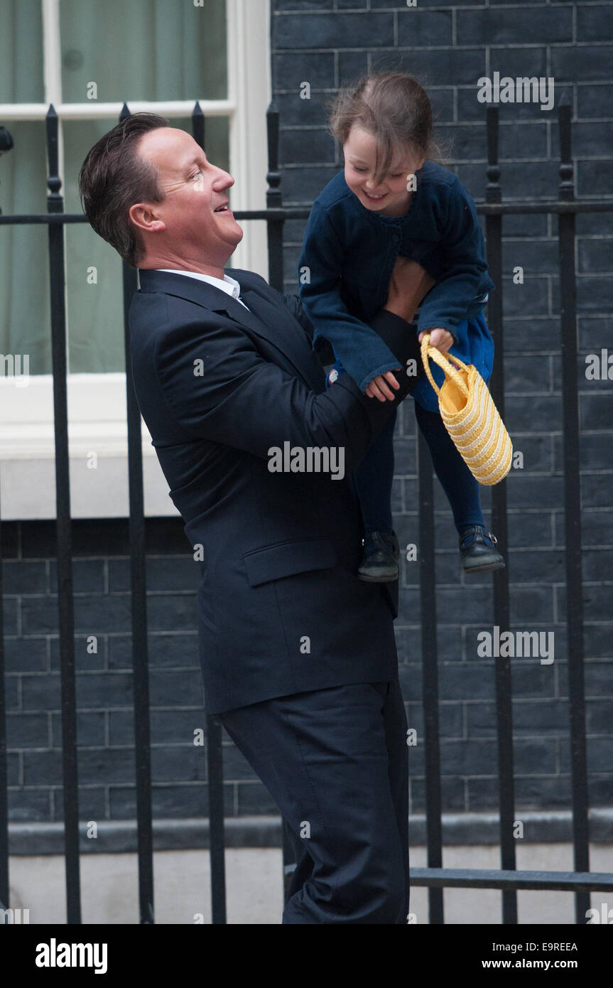 David Cameron leaves Downing Street carrying his daughter Florence ...