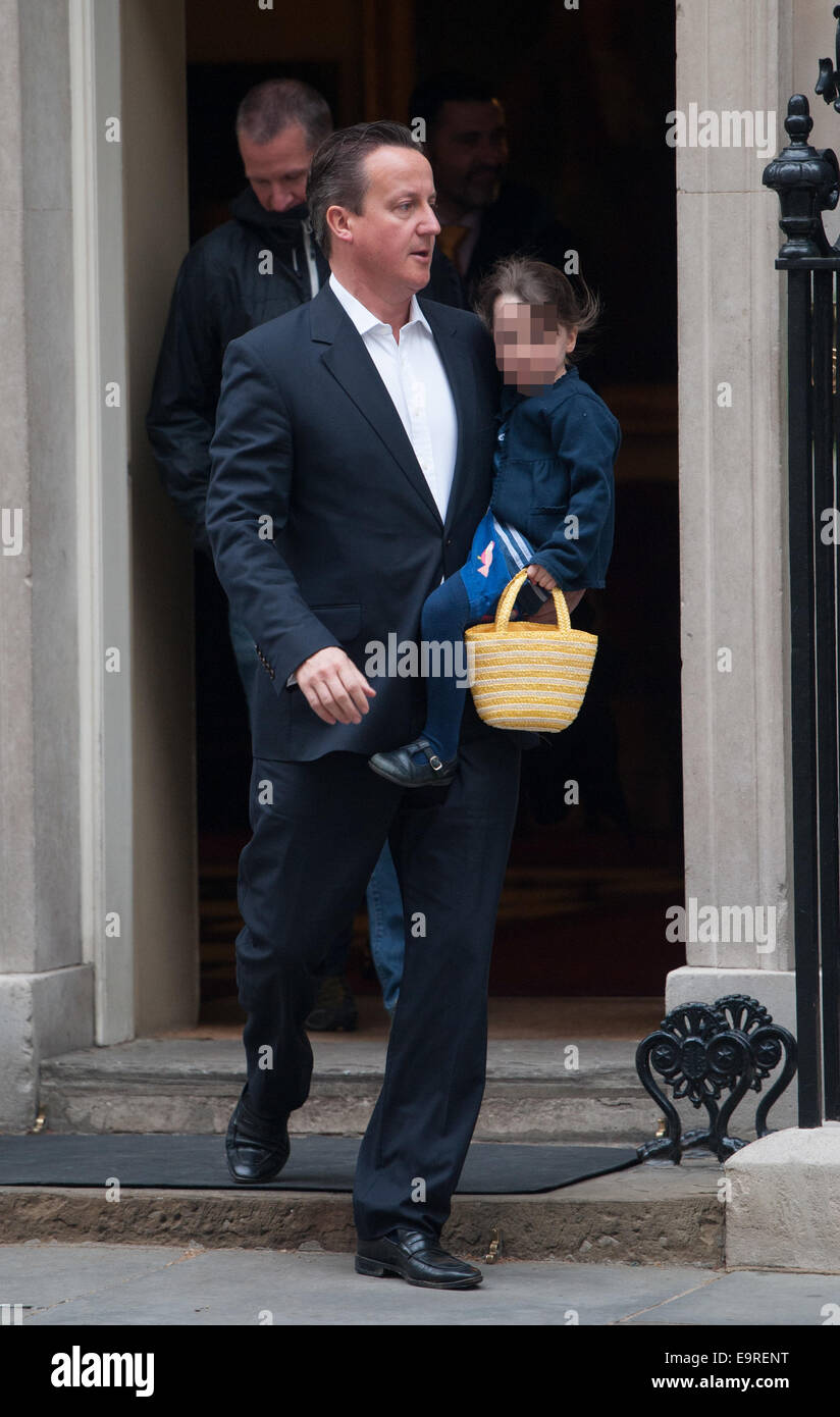David Cameron leaves Downing Street carrying his daughter Florence ...