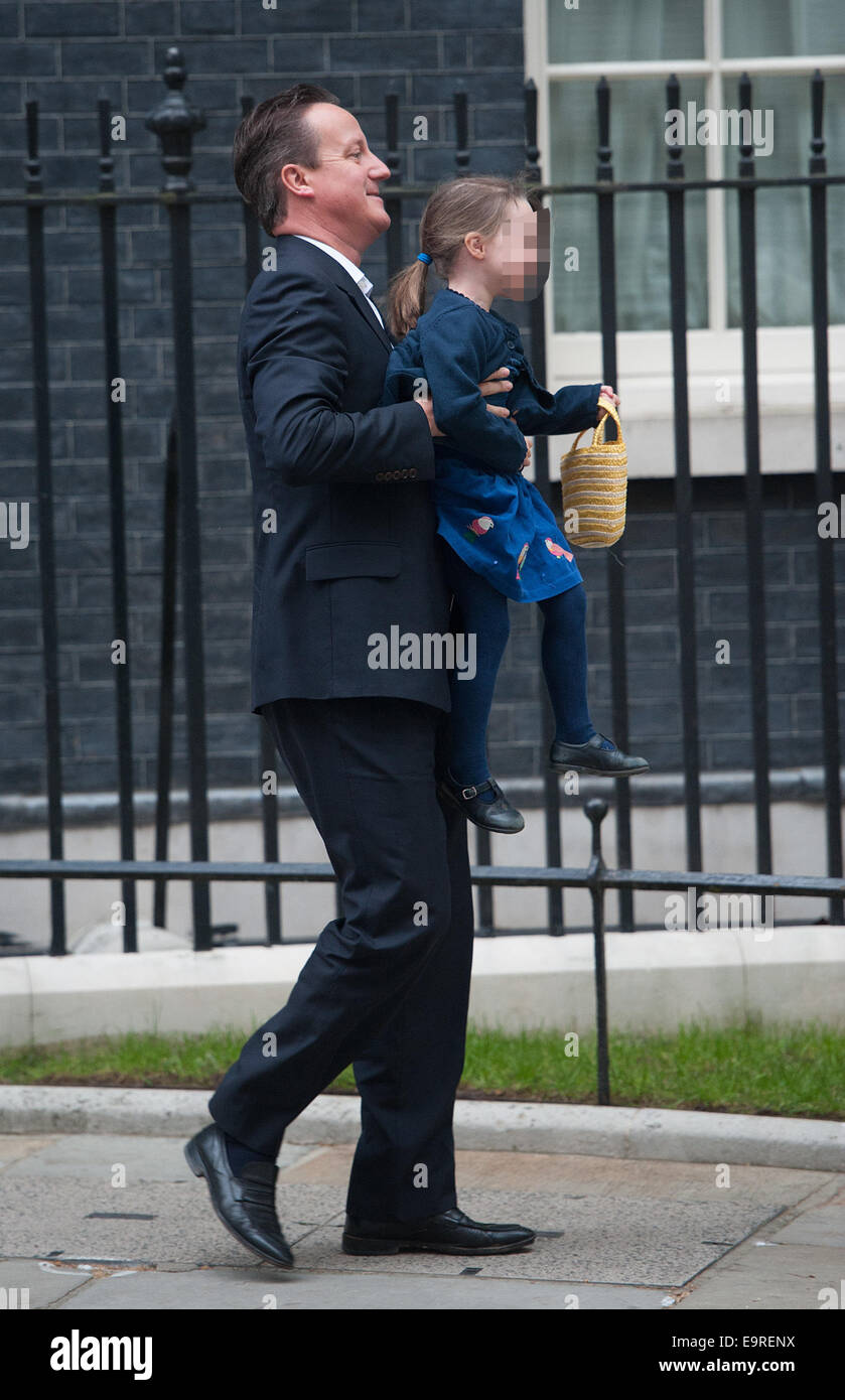 David Cameron leaves Downing Street carrying his daughter Florence ...