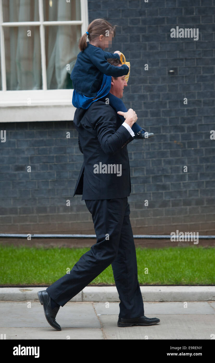 David Cameron leaves Downing Street carrying his daughter Florence ...