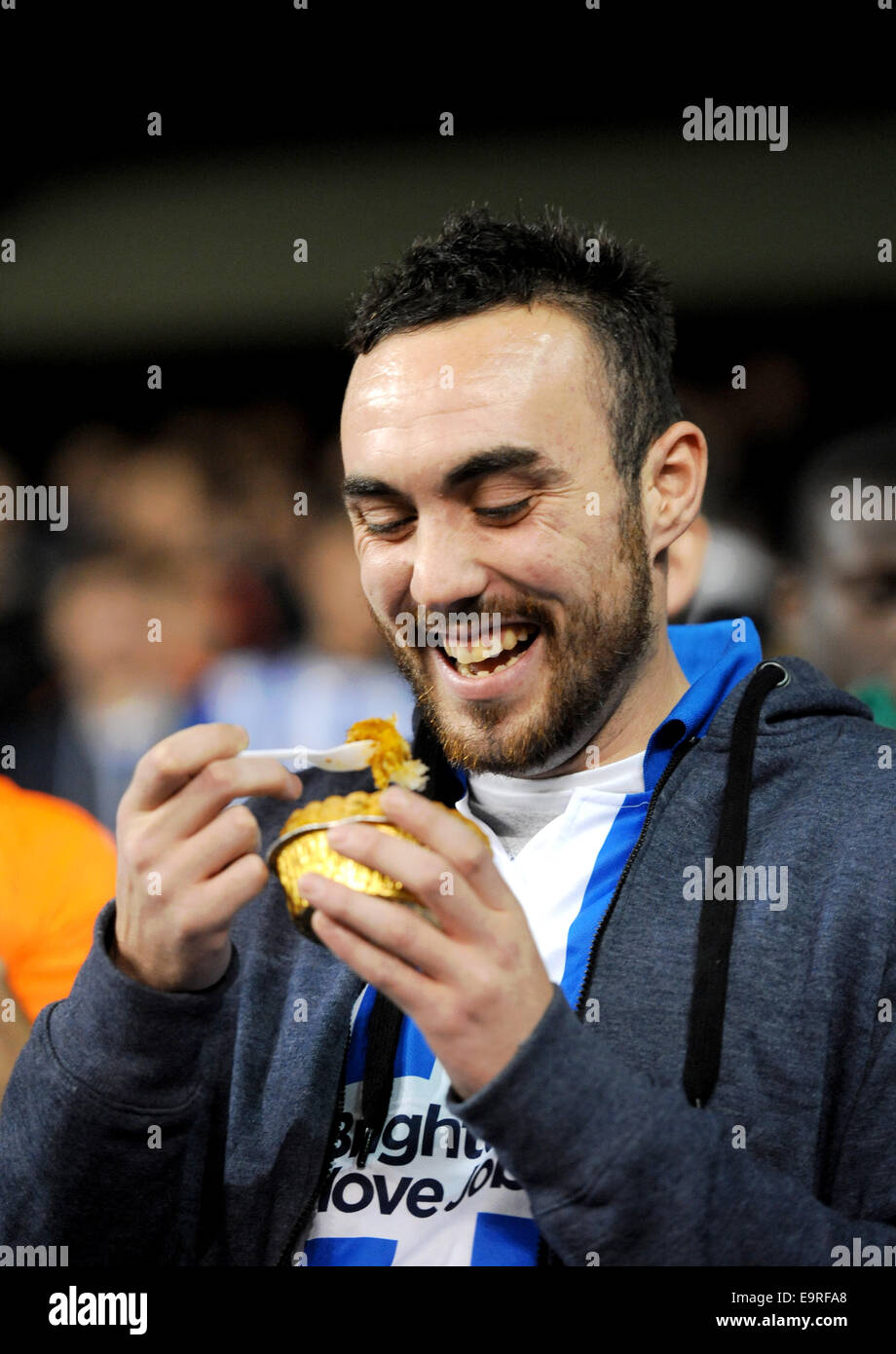 Football fan eating a pie hi-res stock photography and images - Alamy