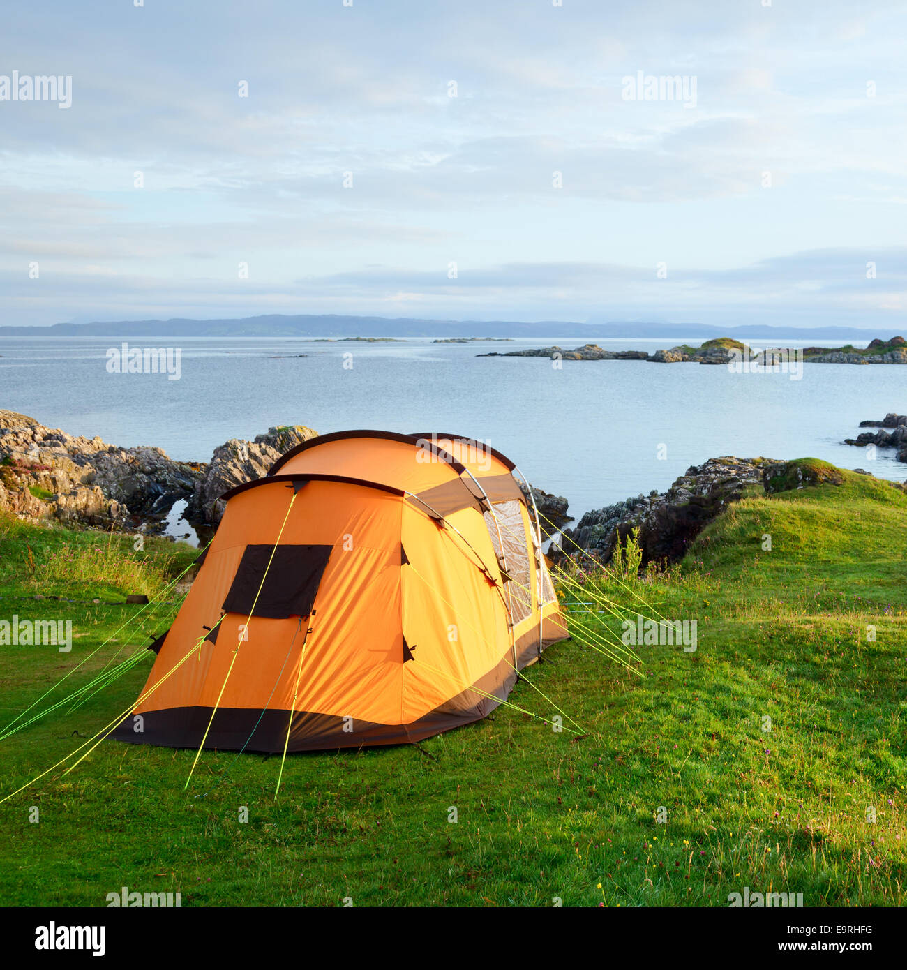 Camping tent on an ocean shore in a morning light Stock Photo - Alamy